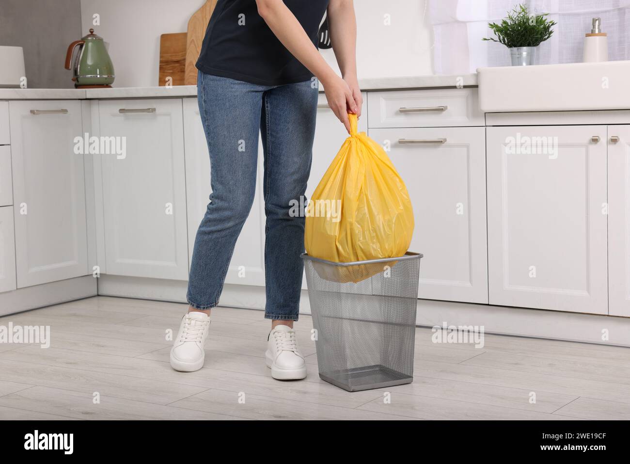 Taking out rubbish female hi-res stock photography and images - Alamy