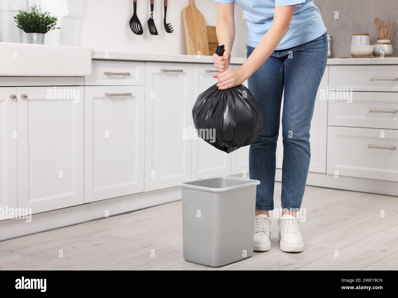 Taking out rubbish female hi-res stock photography and images - Alamy
