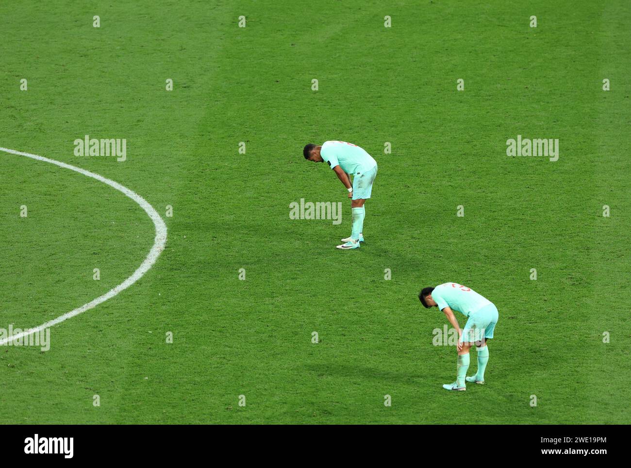 Doha, Qatar. 22nd Jan, 2024. Jiang Guangtai (L) of China reacts after ...