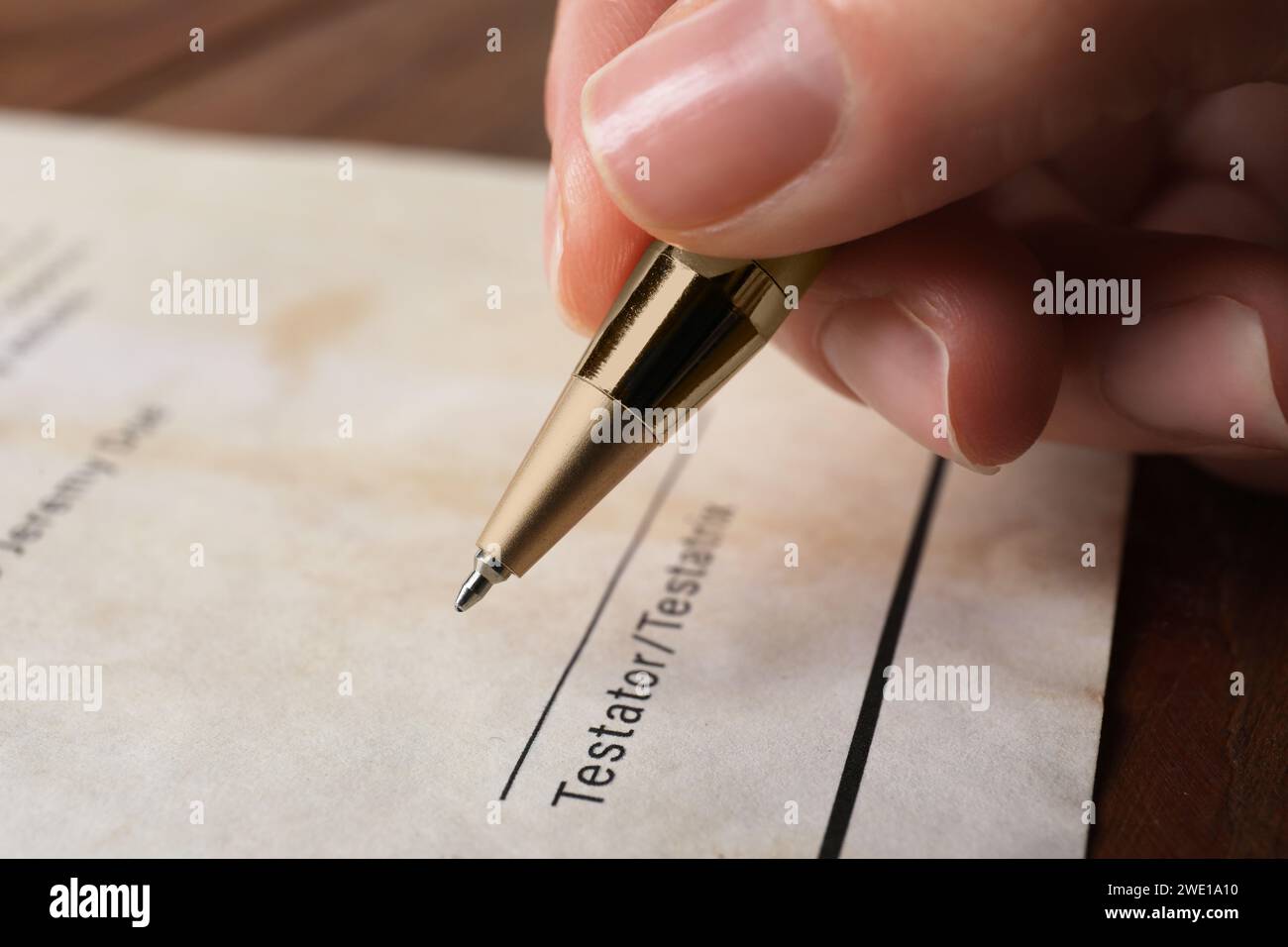 Woman signing Last Will and Testament at table, closeup Stock Photo - Alamy