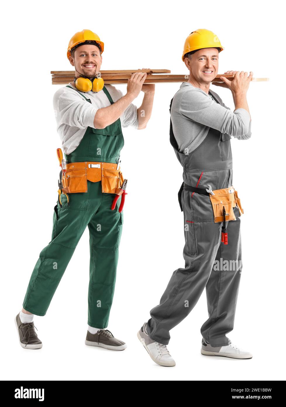 Male builders with wooden planks on white background Stock Photo - Alamy