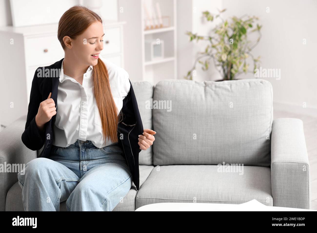 Taking off jacket hi-res stock photography and images - Alamy