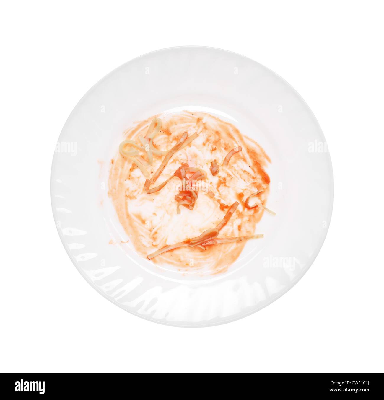 Dirty plate with smeared sauce and pasta on white background, top view ...
