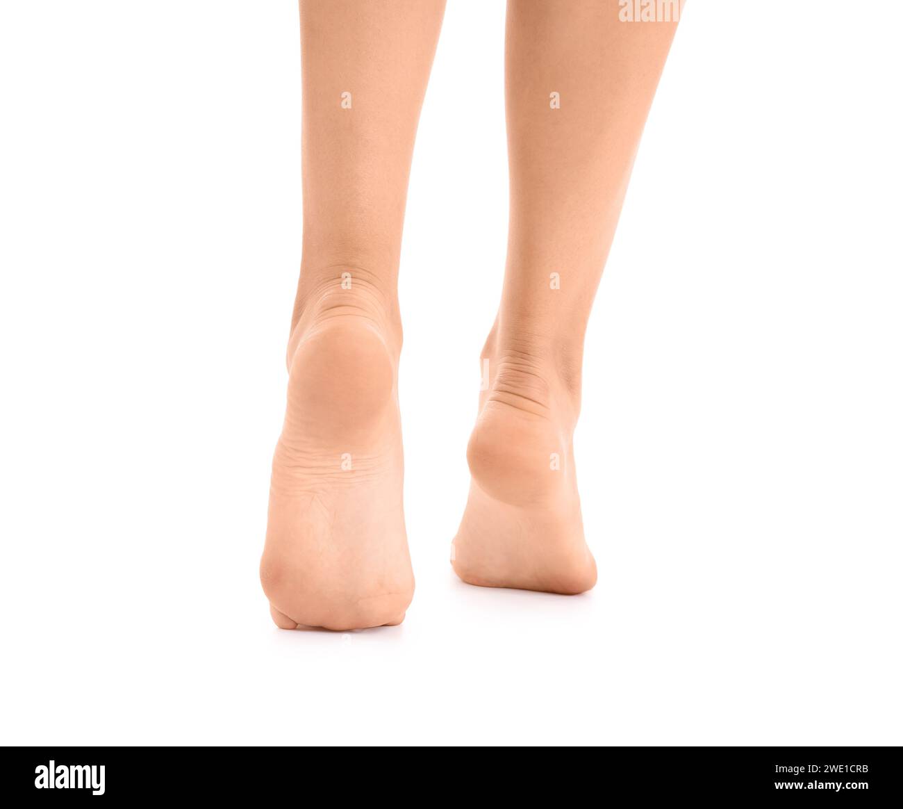 Legs of beautiful young woman after massage on white background, back ...