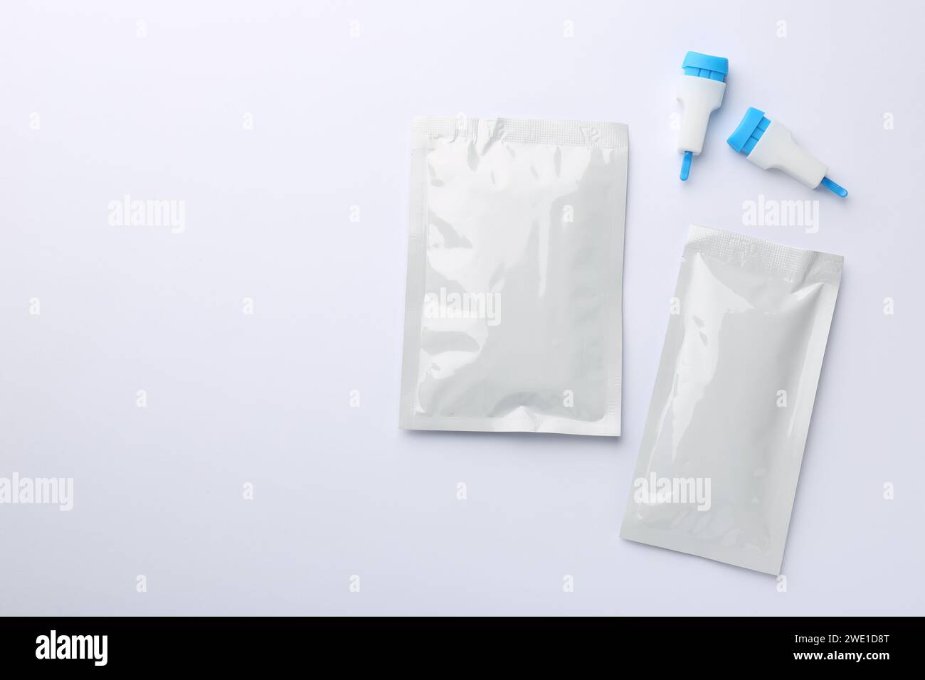 Disposable express test kit on white background, flat lay. Space for ...