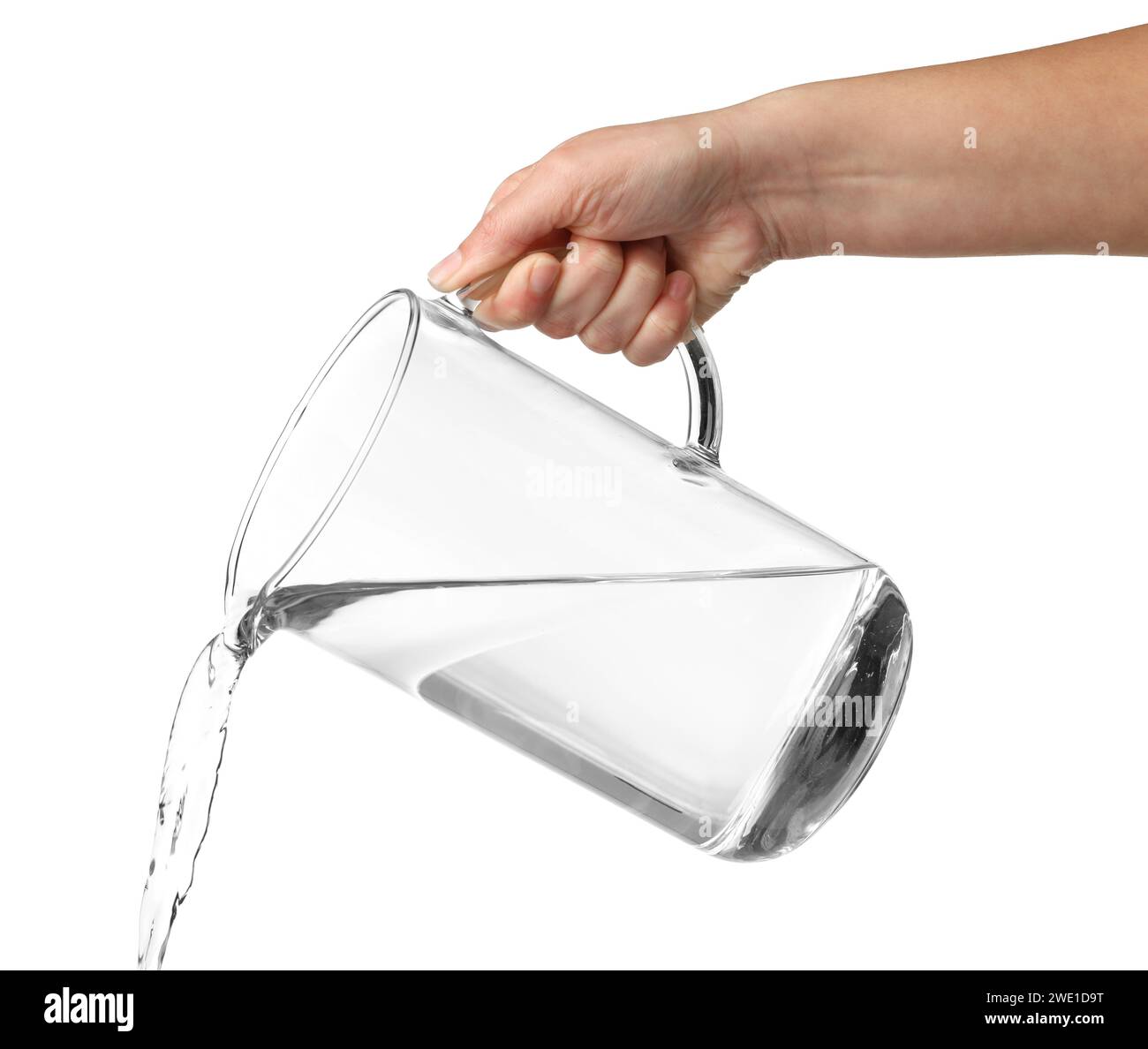Woman pouring water from jug on white background, closeup Stock Photo ...