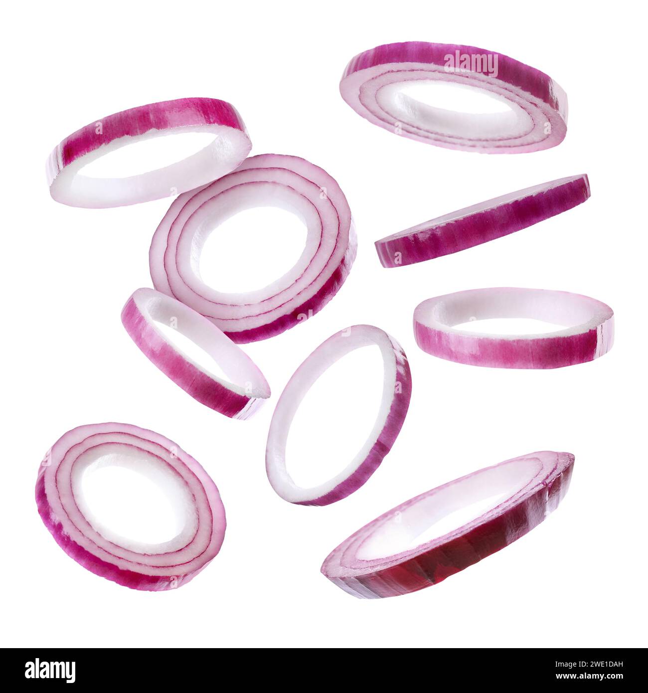 Fresh onion slices falling on white background Stock Photo - Alamy