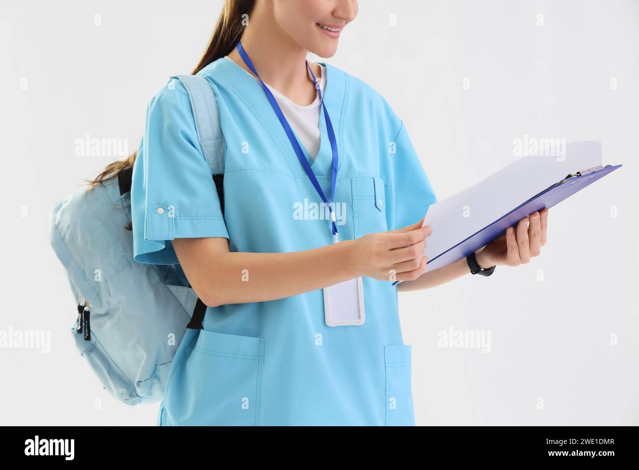 Female medical intern with clipboard on white background, closeup Stock ...