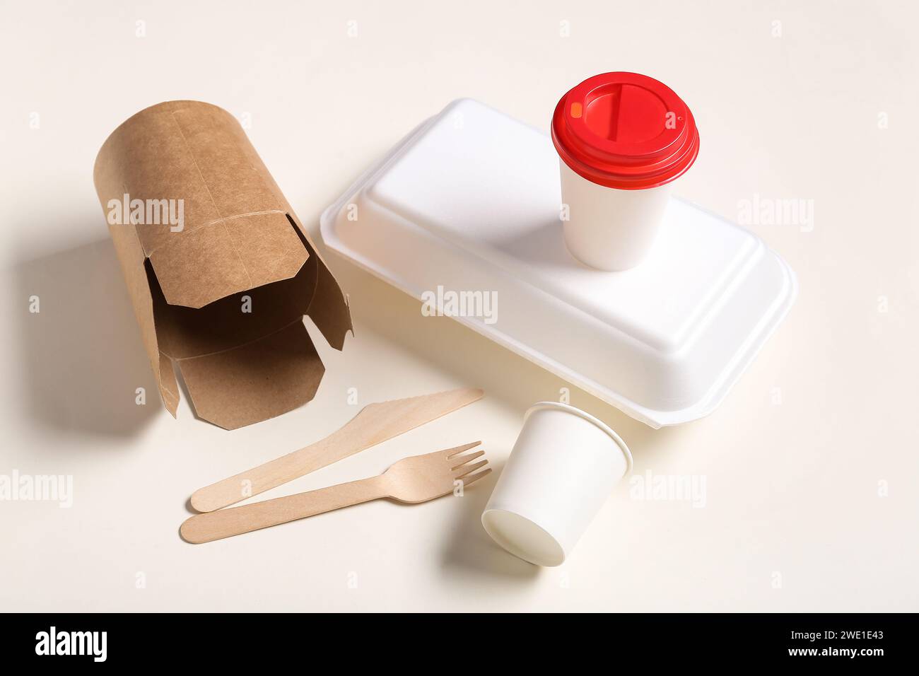 Takeaway paper cups, containers and cutlery on white background Stock ...