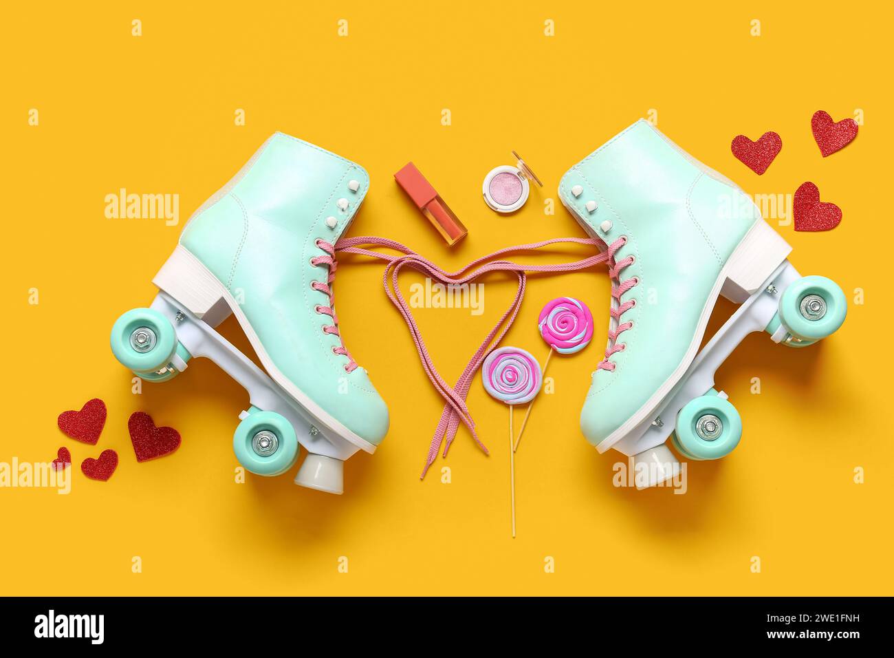 Composition with pair of vintage roller skates and cosmetic products on ...