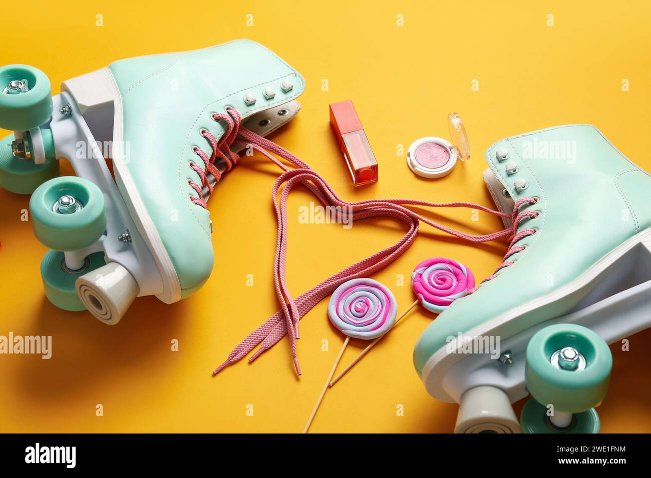 Composition with pair of vintage roller skates and cosmetic products on ...