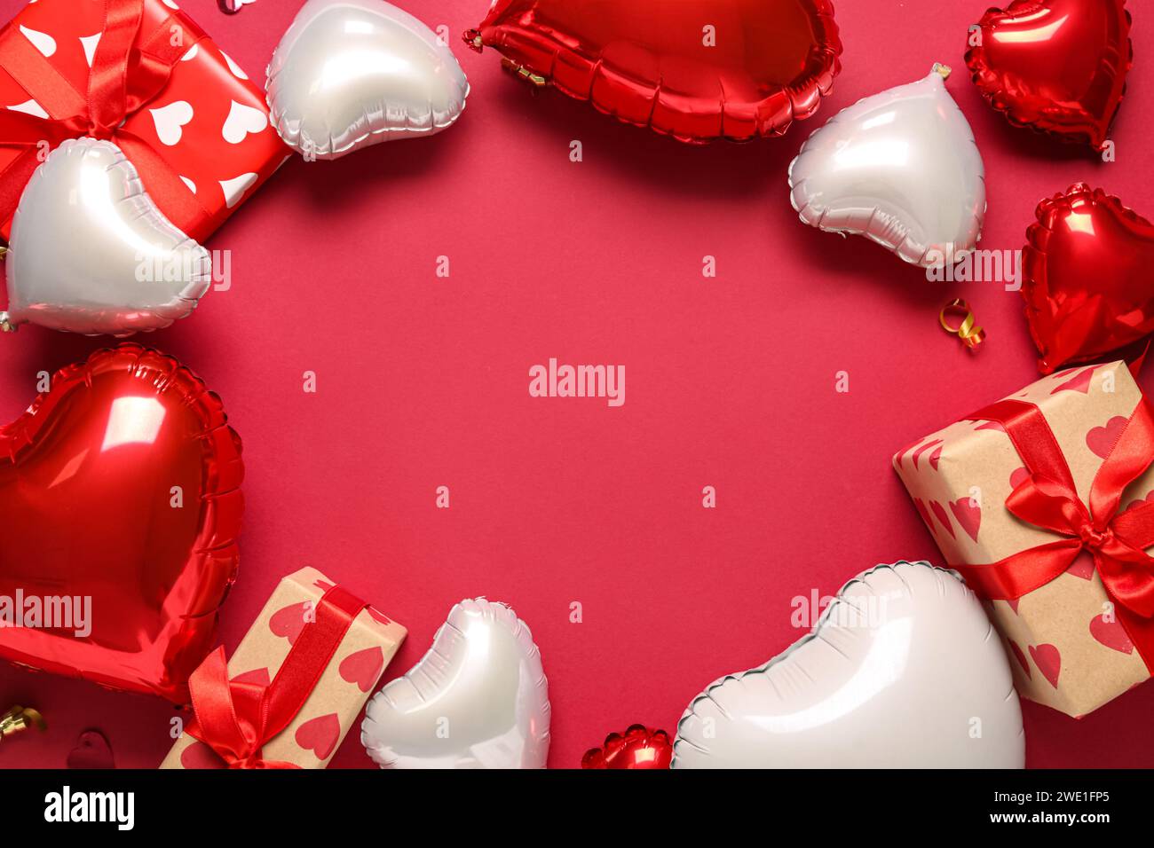 Frame made of heart shaped air balloons and gift boxes on red ...