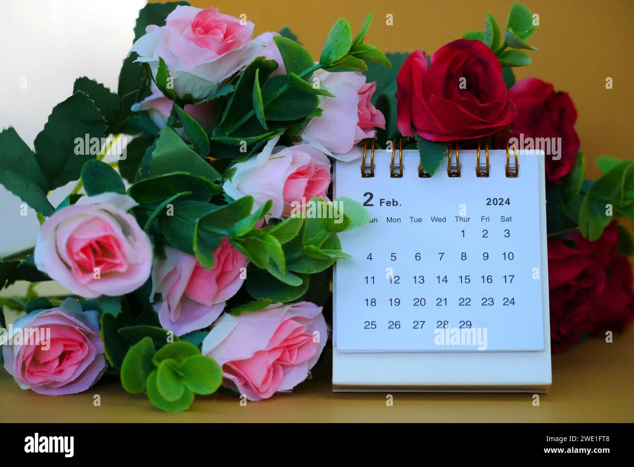 Desk calendar for February 2024 on a gold background with roses Stock ...