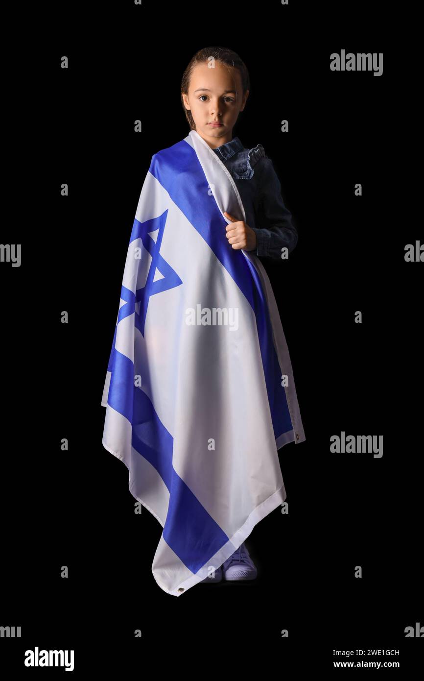 Little Jewish girl with flag of Israel on black background ...