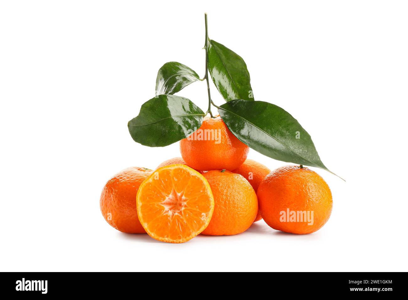 Fresh tangerines with green leaves on white background Stock Photo - Alamy