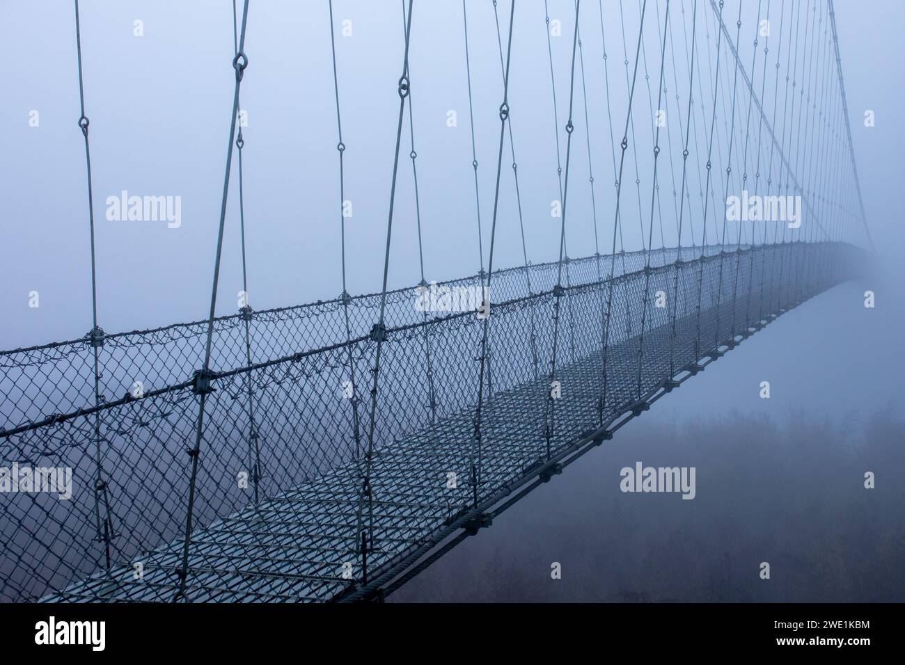 Foggy freezing winter morning, suspension bridge Stock Photo - Alamy