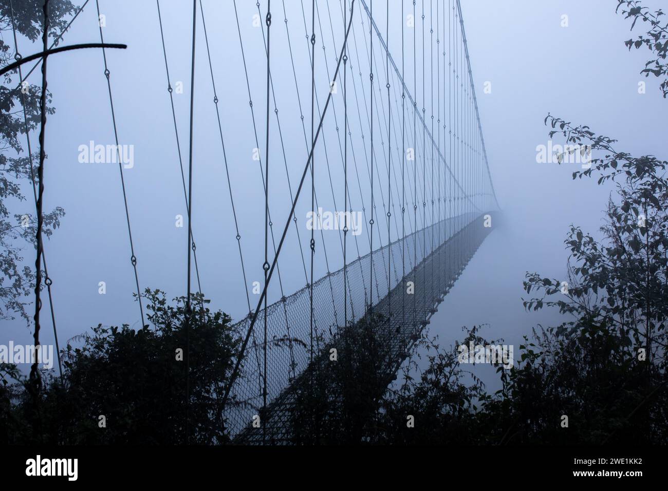 Foggy freezing winter morning, suspension bridge Stock Photo - Alamy