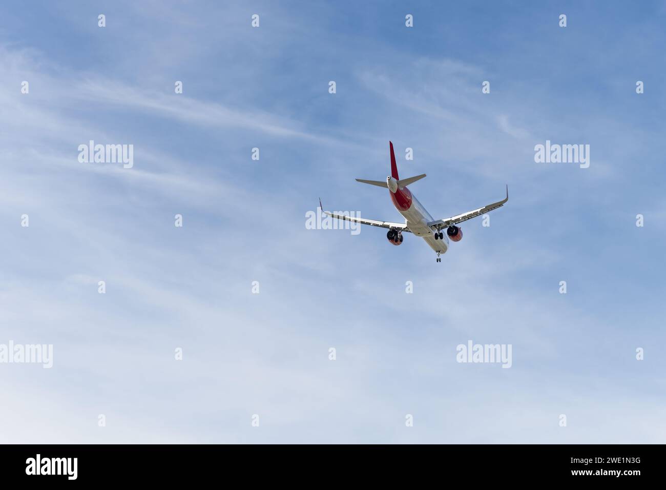 Rear part of the fuselage of a passenger plane about to land at an ...