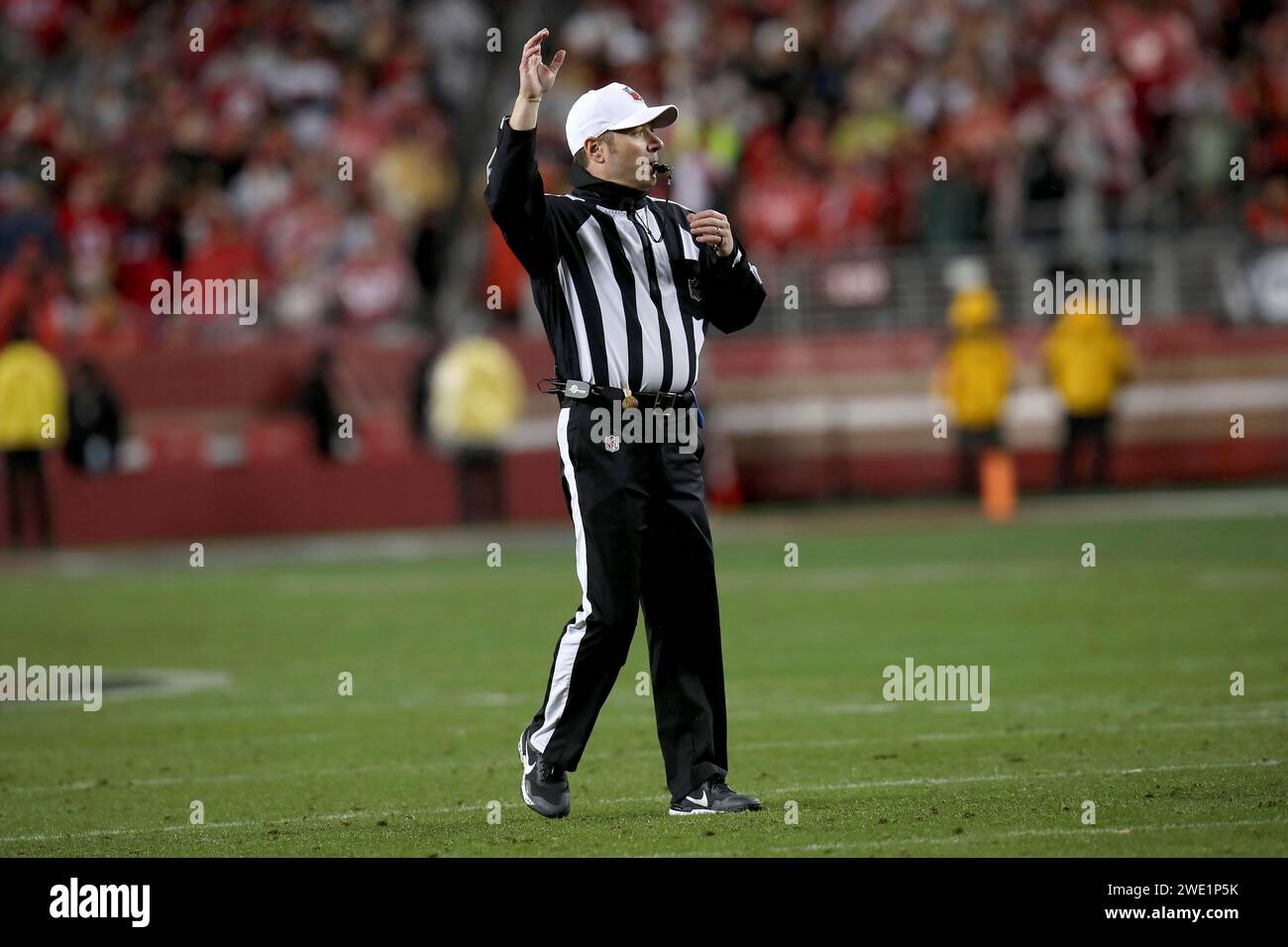 Referee Alex Kemp (55) signals during an NFL divisional round playoff ...