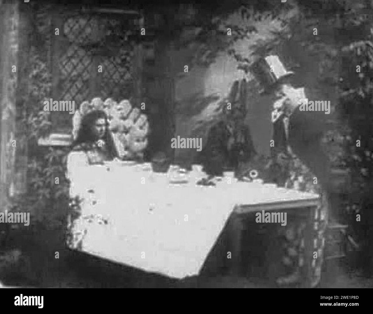 Alice in Wonderland 1903 film tea party Stock Photo - Alamy