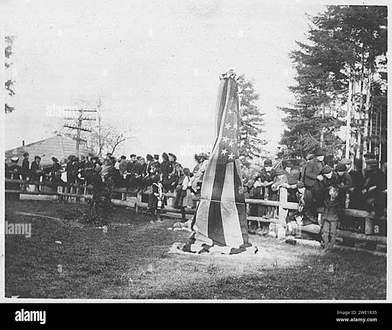 Alki Point Monument dedication showing the monument wrapped in a United ...