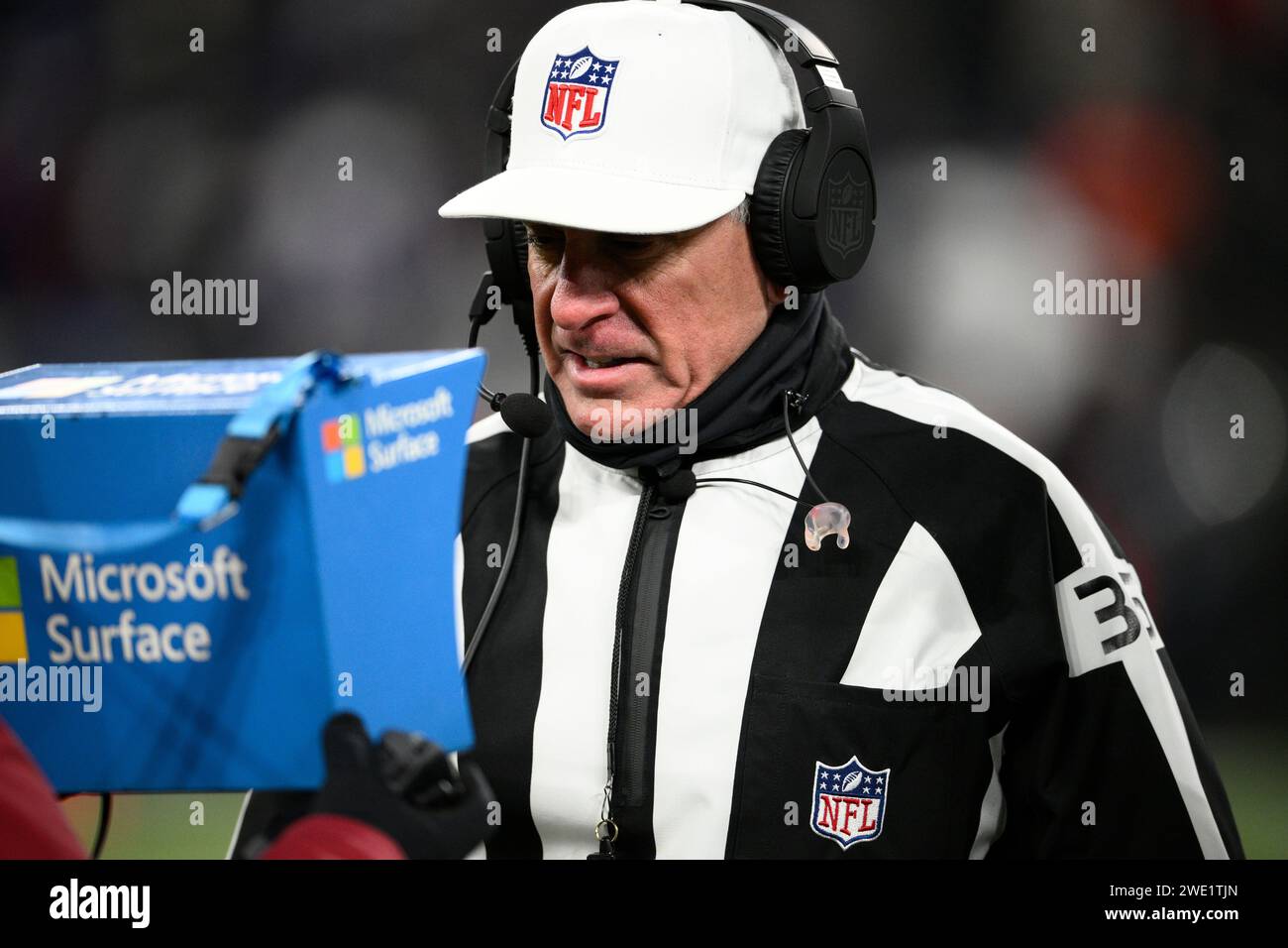 NFL referee John Hussey looks at a replay during the second half of an ...