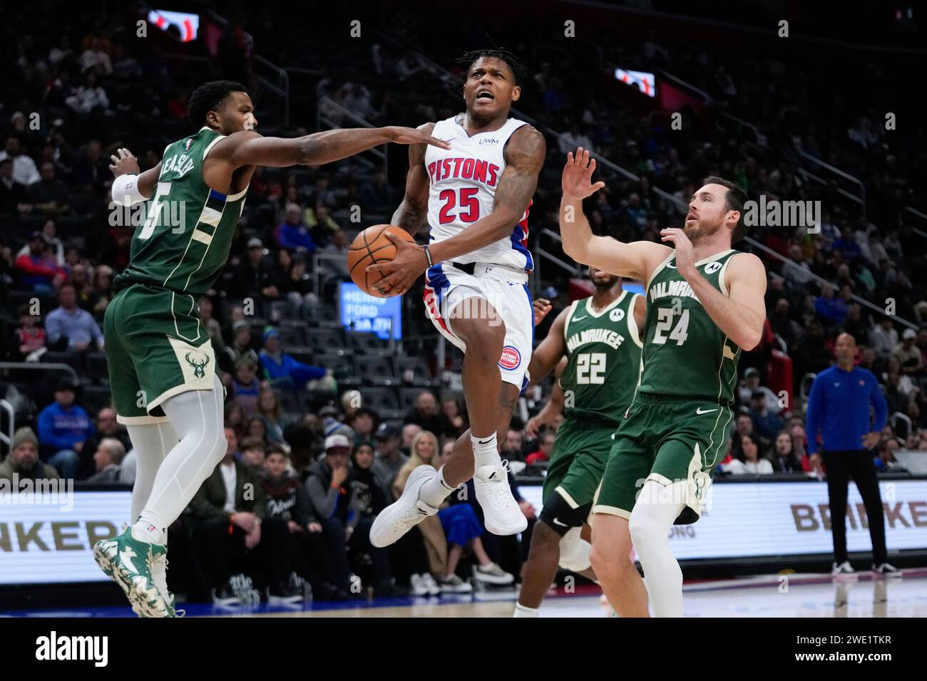 Detroit Pistons guard Marcus Sasser (25) drives between Milwaukee Bucks ...