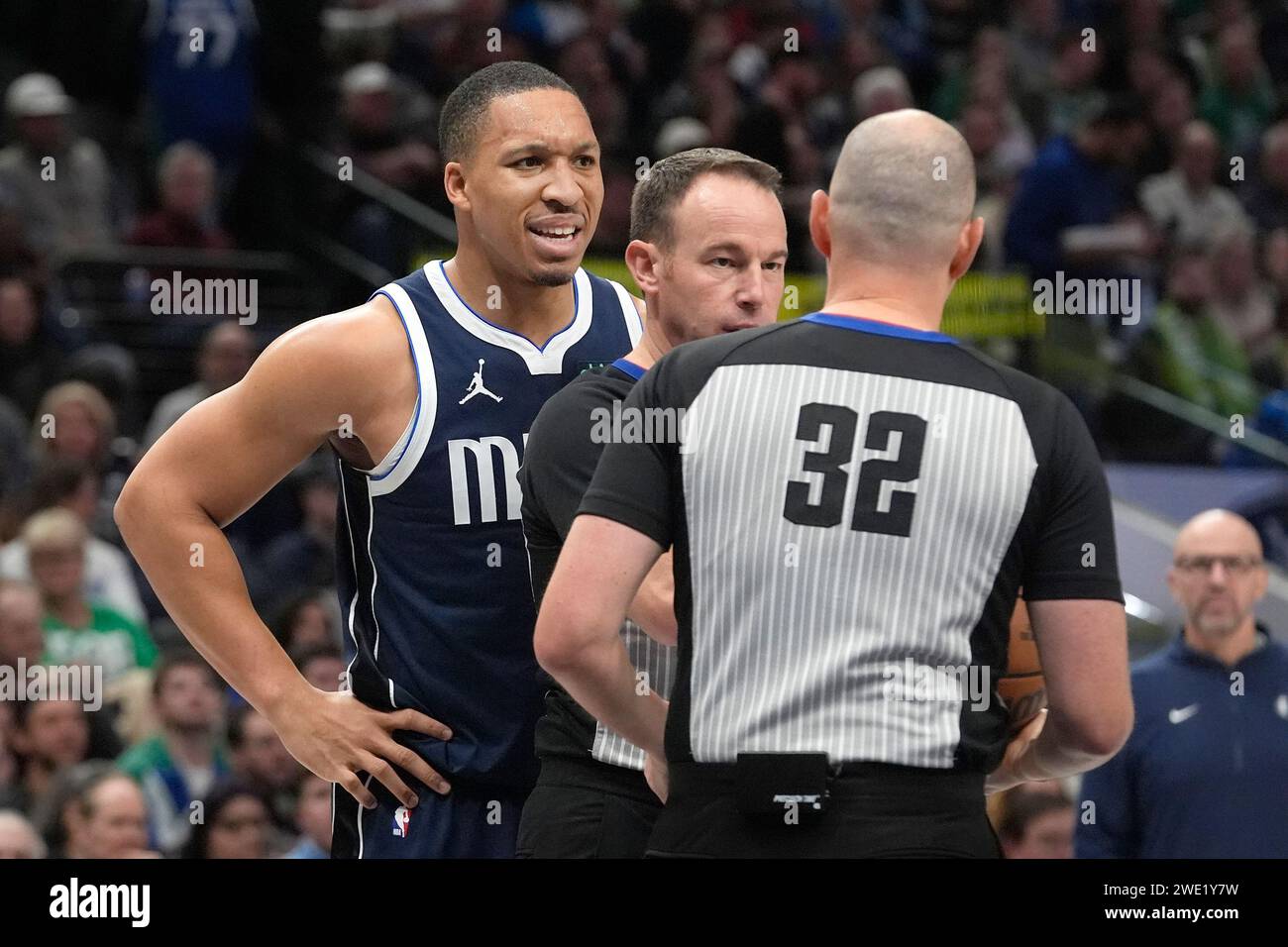 Dallas Mavericks forward Grant Williams, left, questions a call by ...