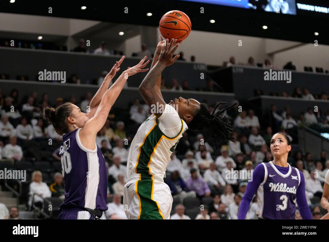 Baylor forward Dre'Una Edwards, center, takes a shot over Kansas State ...