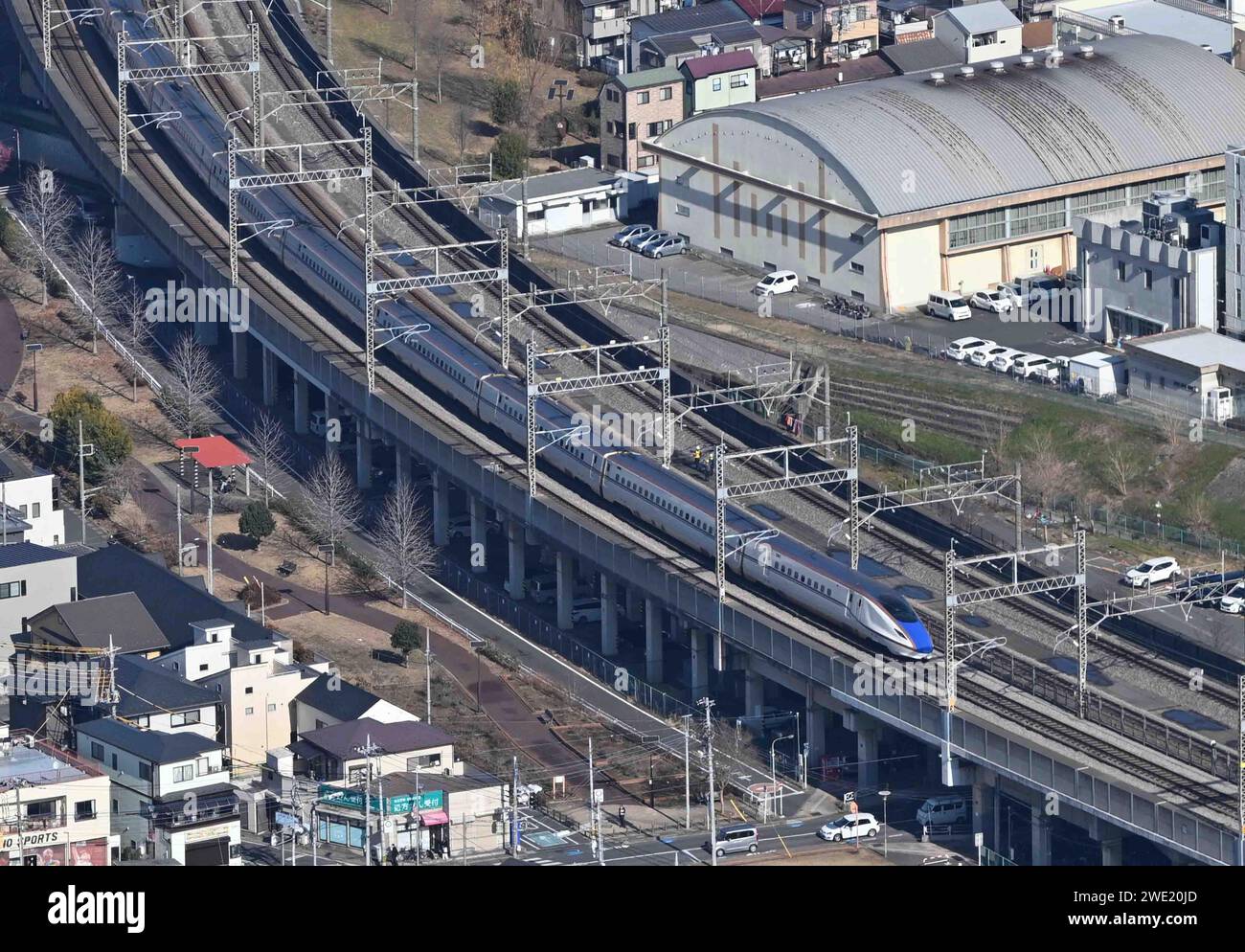 An aerial photo shows Shinkansen (Bullet train) stopped on the tracks ...