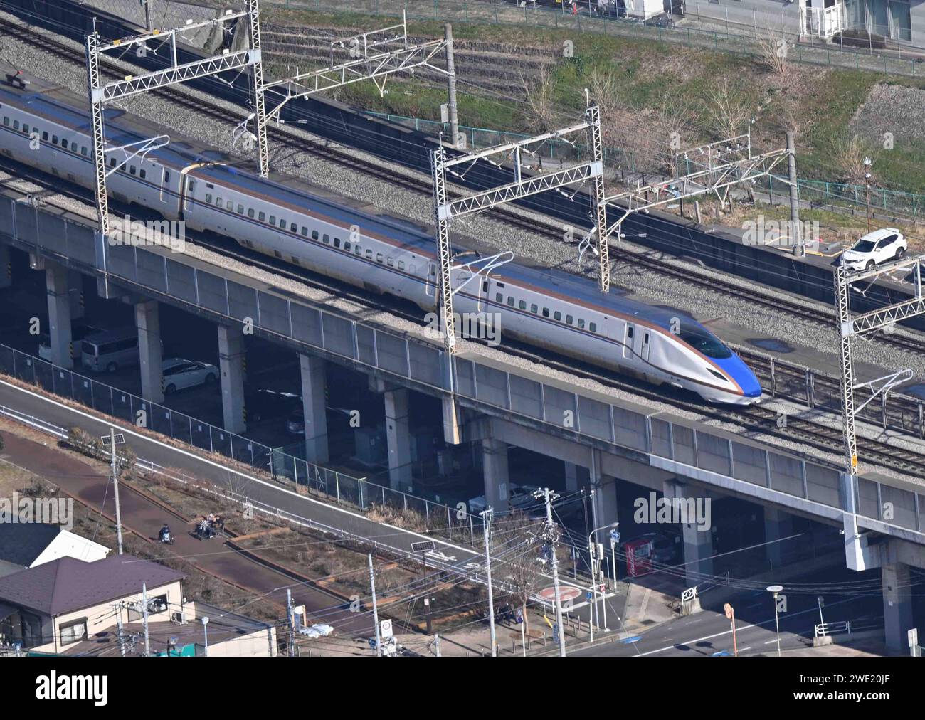 An aerial photo shows Shinkansen (Bullet train) stopped on the tracks ...