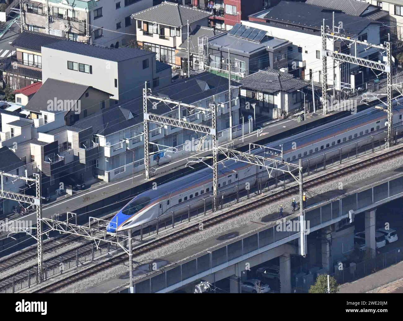 An aerial photo shows Shinkansen (Bullet train) stopped on the tracks ...