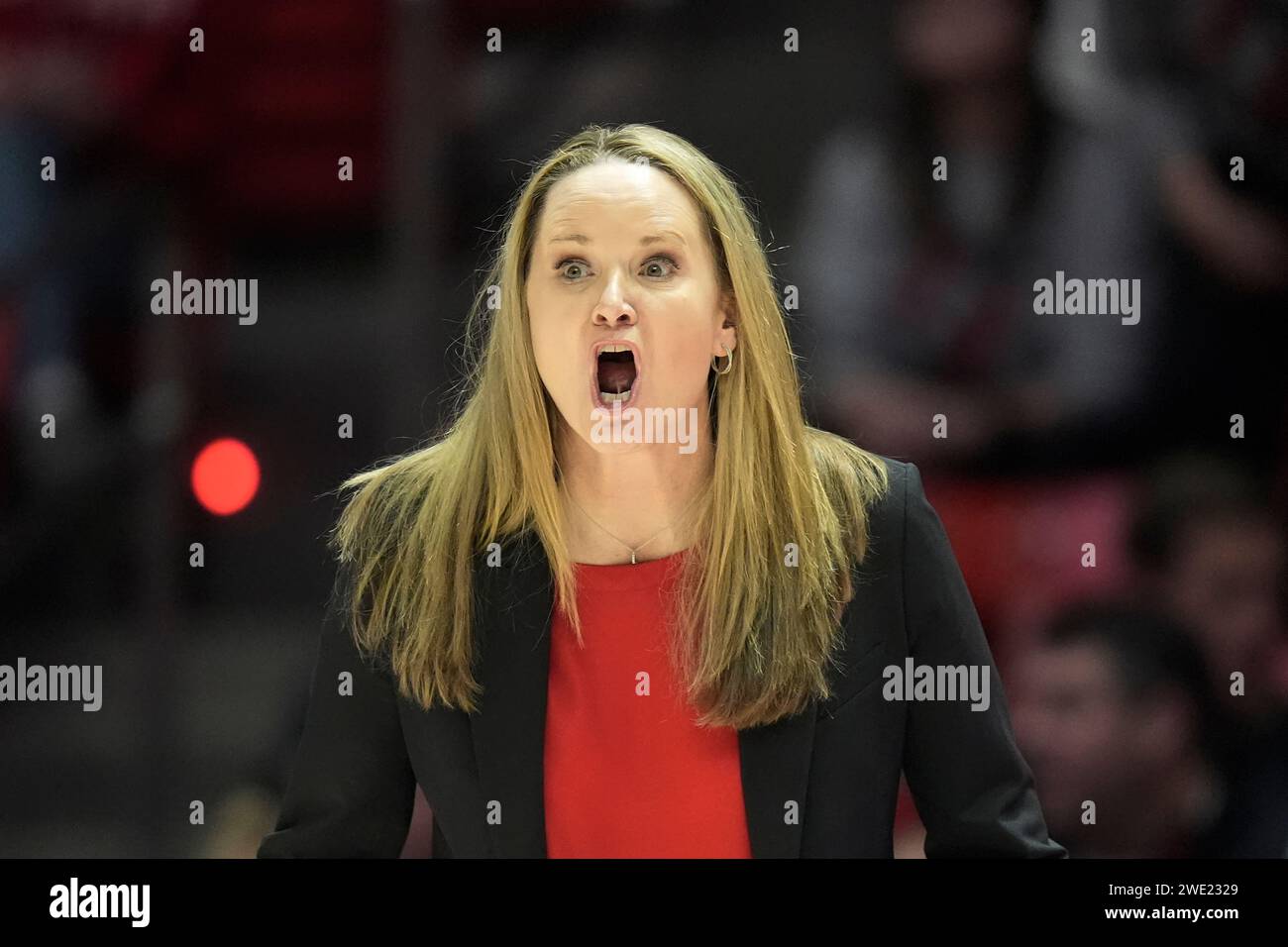 Utah head coach Lynne Roberts directs her team during the second half ...