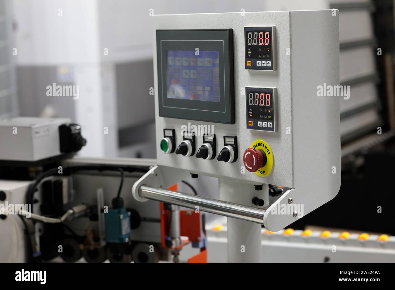 Control console of automatic edge banding machine. Selective focus ...