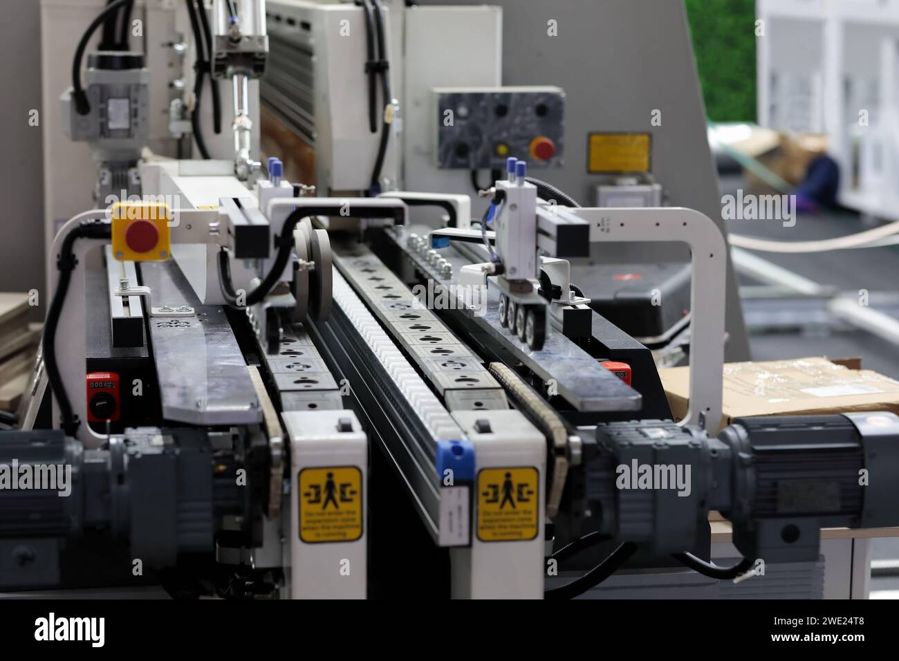Industrial automated machine at furniture factory. Wood chipboard ...