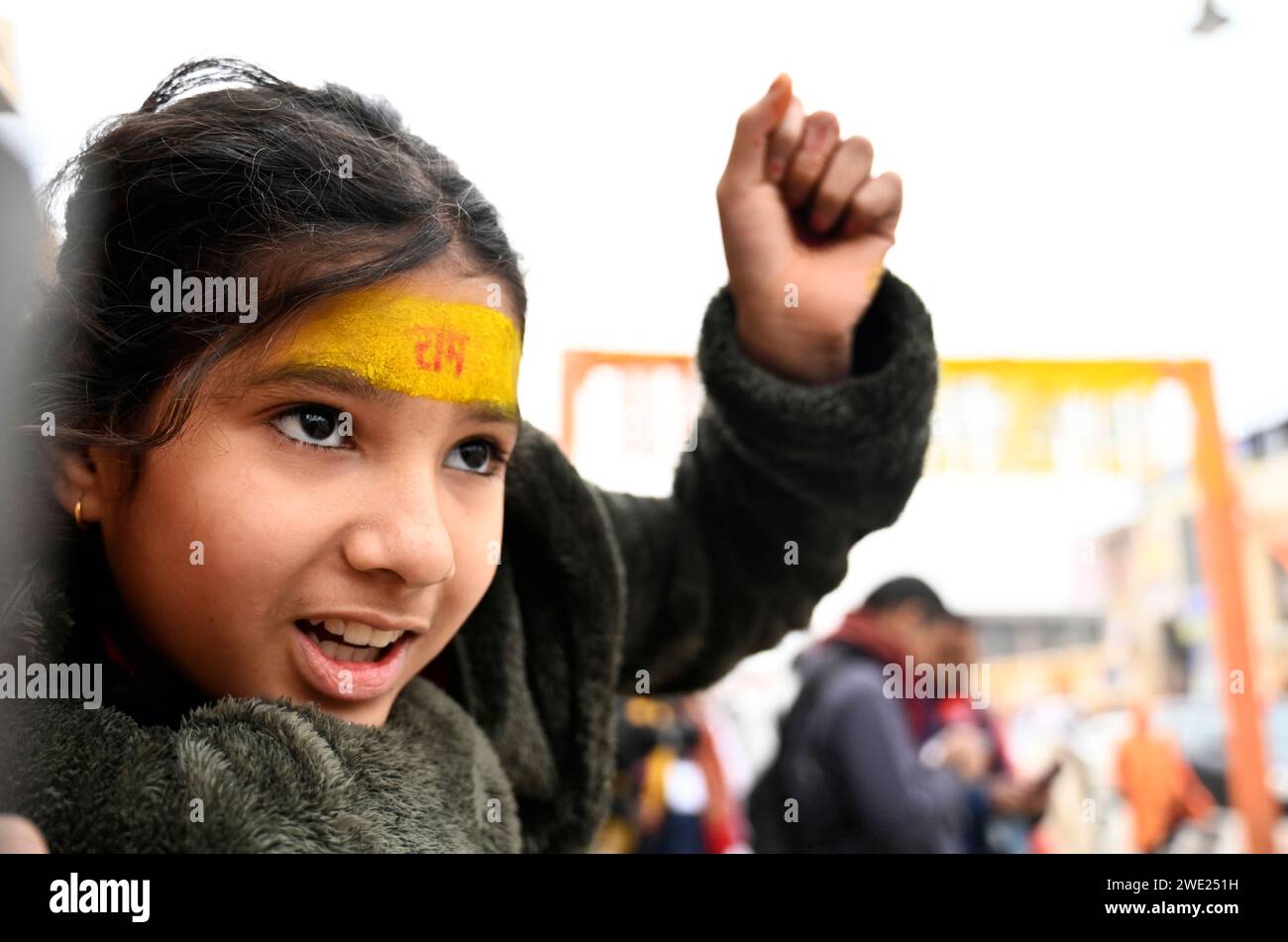 AYODHYA, INDIA - JANUARY 22: A littile girls looks happy watching the consecration ceremony of ...