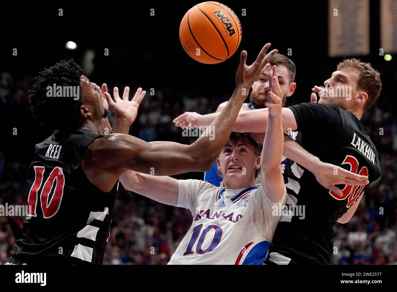 Cincinnati guard Josh Reed (10) and forward Viktor Lakhin (30) battle ...
