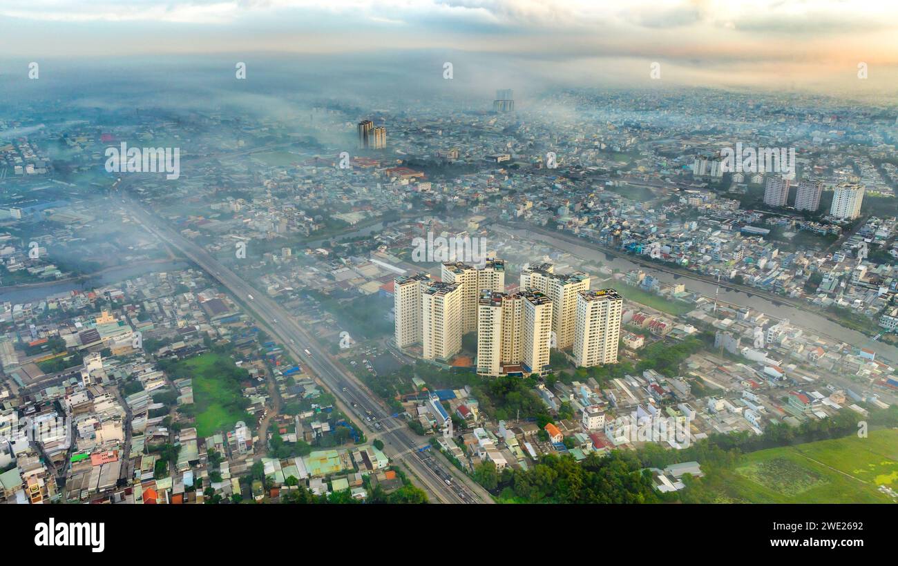 Aerial view of Saigon cityscape at morning with misty sky in Southern ...