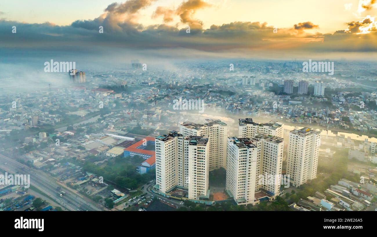 Aerial view of Saigon cityscape at morning with misty sky in Southern ...