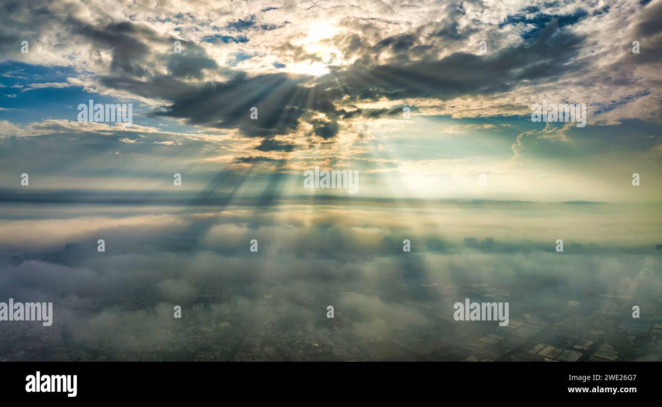 Aerial view of Saigon cityscape at morning with misty sun rays sky in ...