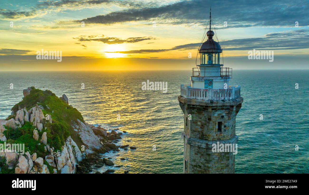 Ke Ga lighthouse is located on an island near the shore seen from above ...