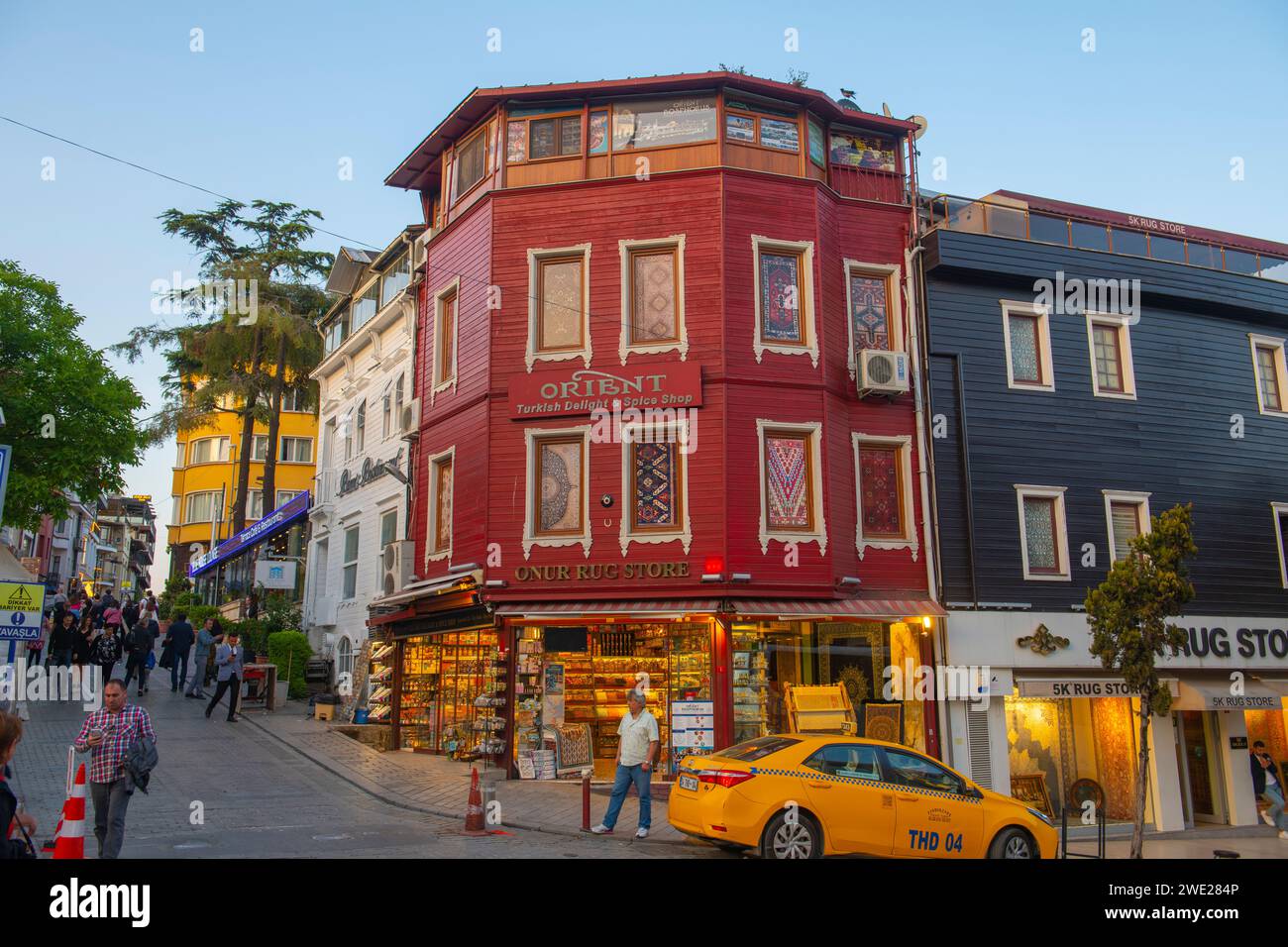 Historic commercial buildings on Torun Sokak Street at sunset in ...
