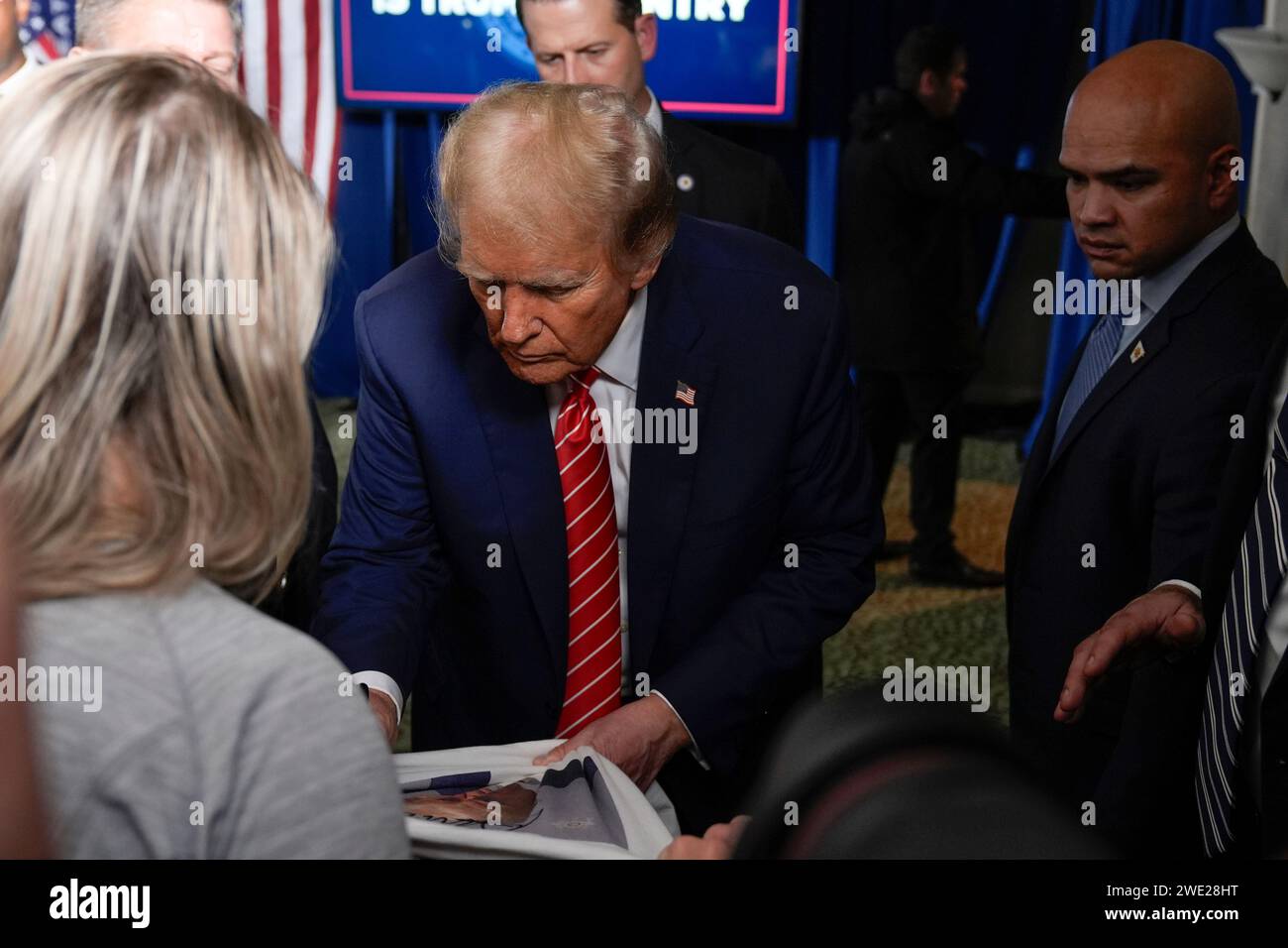 Republican presidential candidate former President Donald Trump signs ...