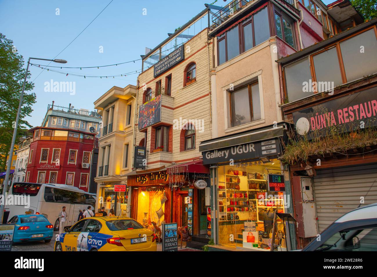 Historic commercial buildings on Torun Sokak Street at sunset in ...