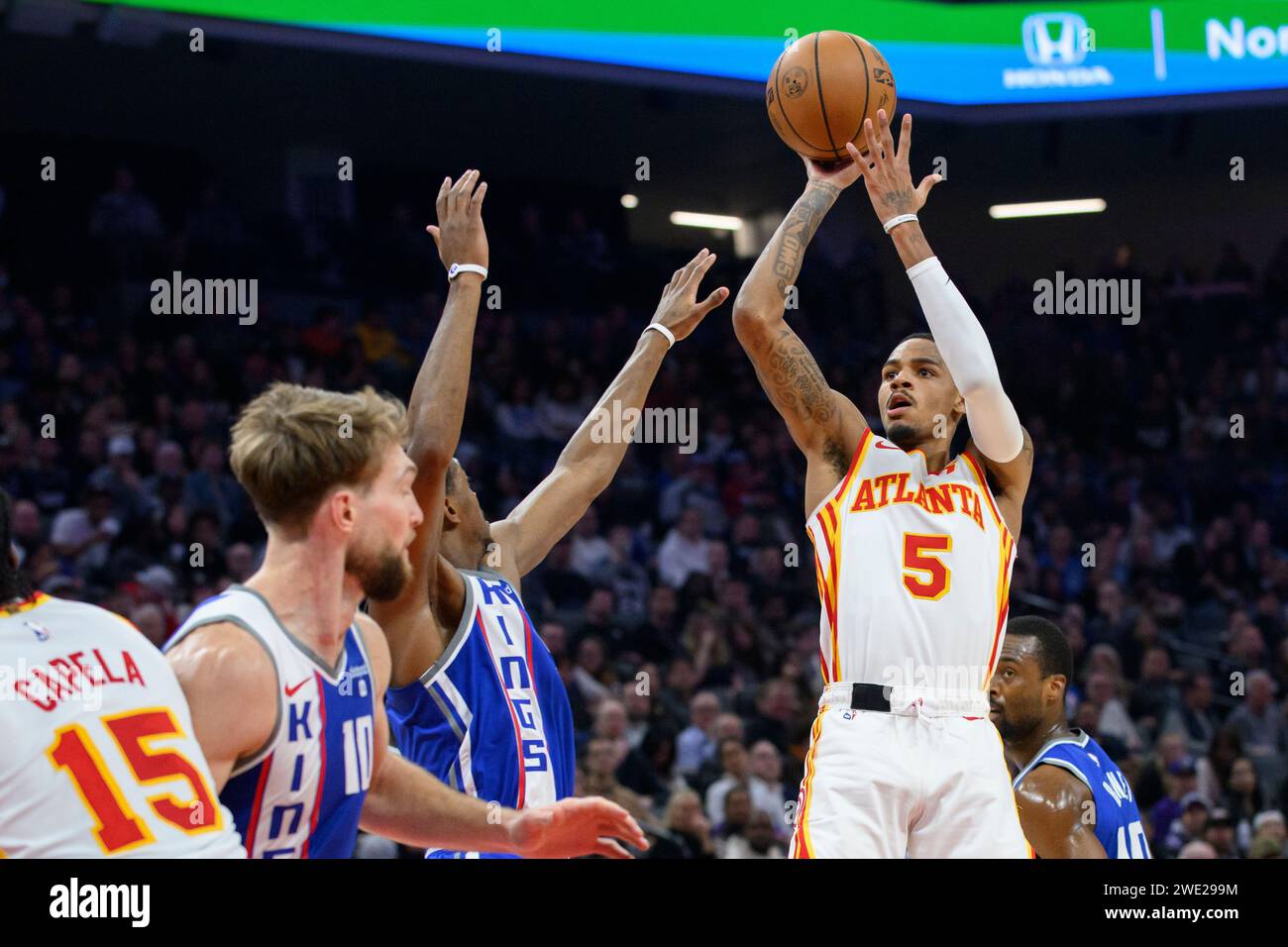 Atlanta Hawks guard Dejounte Murray (5) shoots over Sacramento Kings forward Domantas Sabonis ...