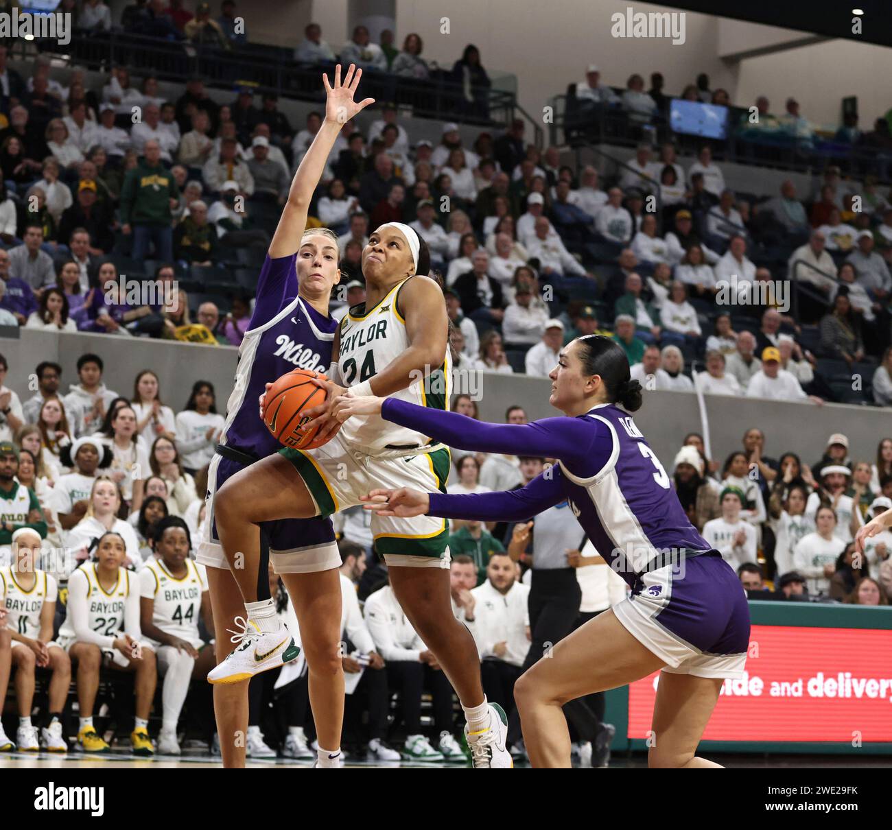 Baylor guard Sarah Andrews (24) tries to drive between Kansas State ...