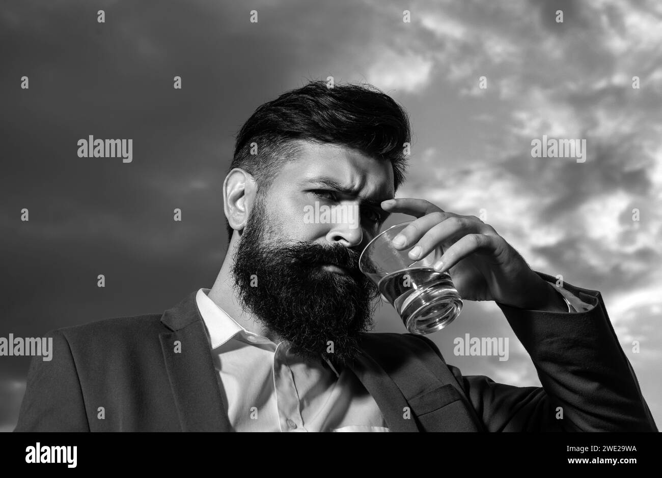 Rich man tasting cognac in Black and White Stock Photos & Images - Alamy