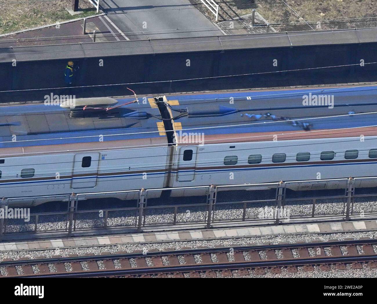 An aerial photo shows Shinkansen (Bullet train) stopped on the tracks ...
