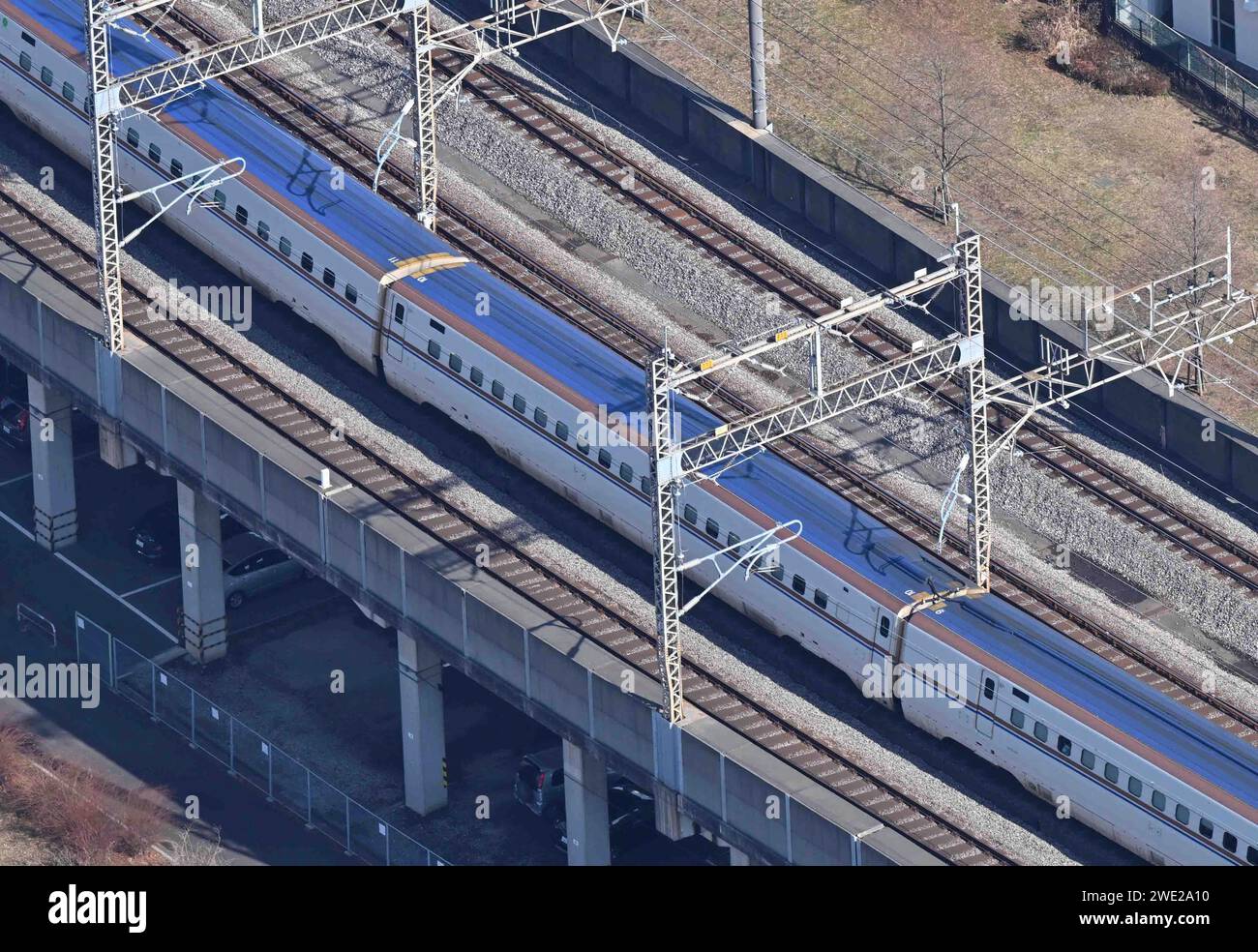 An aerial photo shows Shinkansen (Bullet train) stopped on the tracks ...