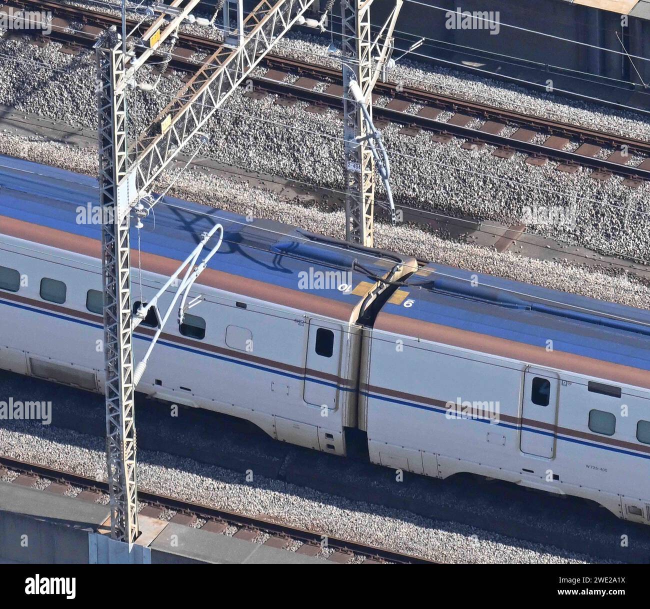 An aerial photo shows Shinkansen (Bullet train) stopped on the tracks ...